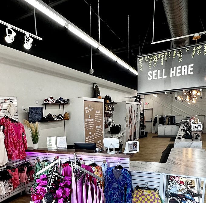 "Sell Here" signs guide fashion recyclers through the process, turning last season's impulse buys into someone else's treasure.