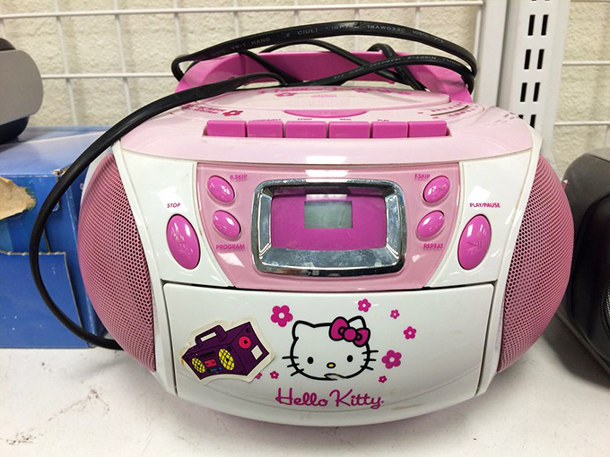 Hello Kitty meets nostalgia in this pink boombox. Someone's childhood treasure awaits its second act in a new home.