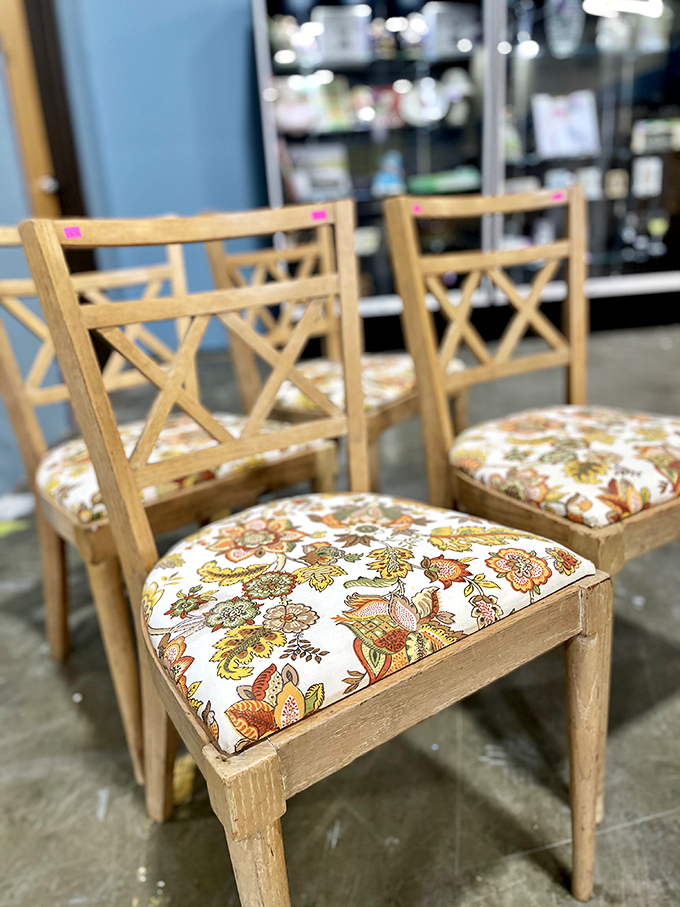 Dinner party ready! These vintage chairs with their vibrant floral upholstery are just begging for guests to gather around and stay awhile.