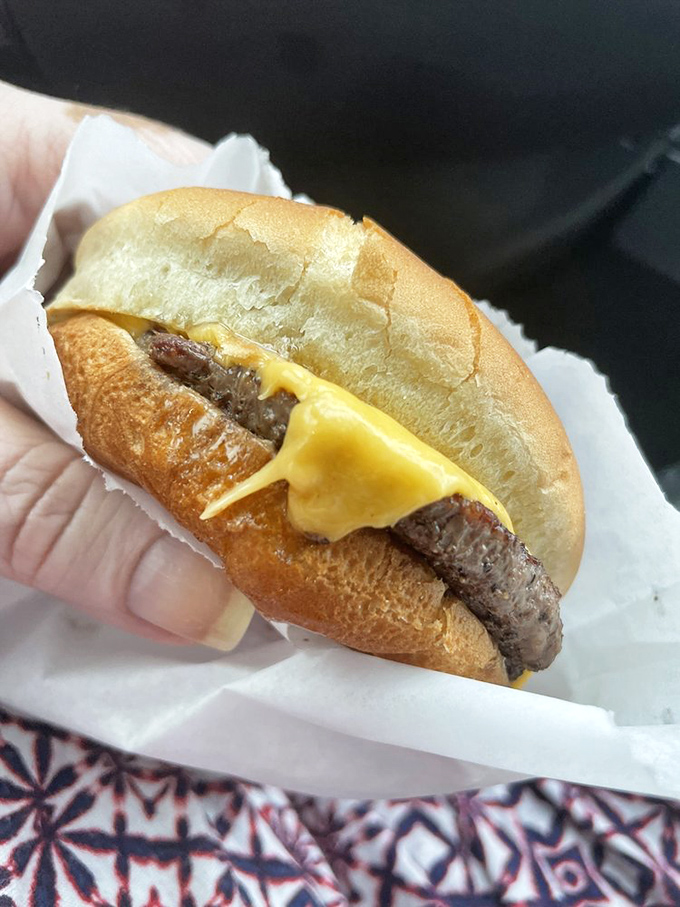 This isn't just a cheeseburger&mdash;it's edible nostalgia, perfectly melted American cheese embracing a beef patty like an old friend.