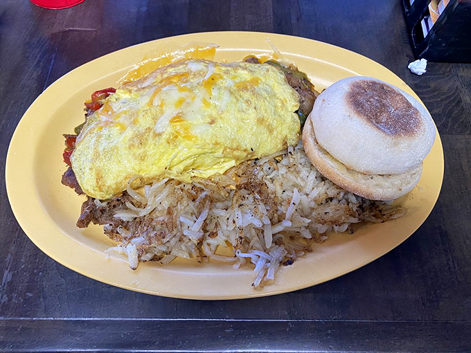 The cheesesteak omelet proves breakfast isn't just sweet talk&mdash;this savory masterpiece pairs perfectly with crispy hashbrowns and a biscuit sidekick.