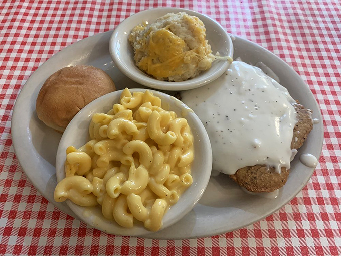 Country-fried steak smothered in pepper-flecked gravy alongside mac and cheese that's achieved that perfect golden-to-creamy ratio.