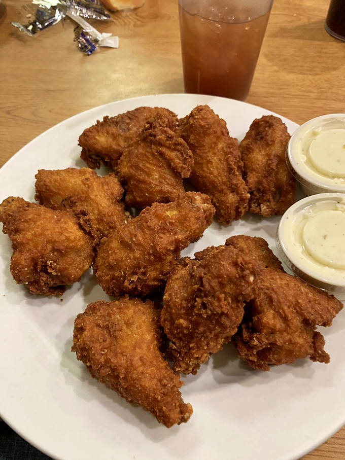 Golden-fried chicken wings that crunch louder than your diet plans. Worth every napkin and guilty smile.