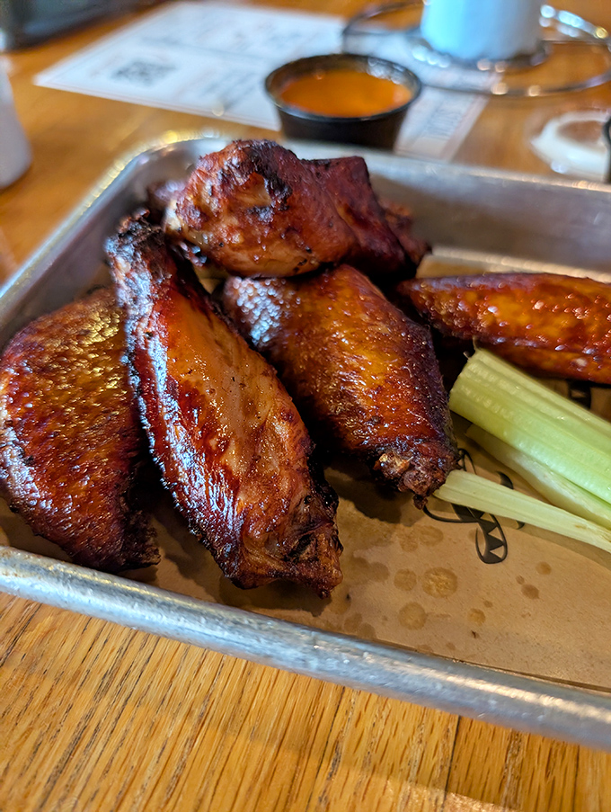 These wings aren't just cooked, they're transformed&mdash;glistening with sauce and promising the kind of flavor that makes conversation stop mid-sentence.