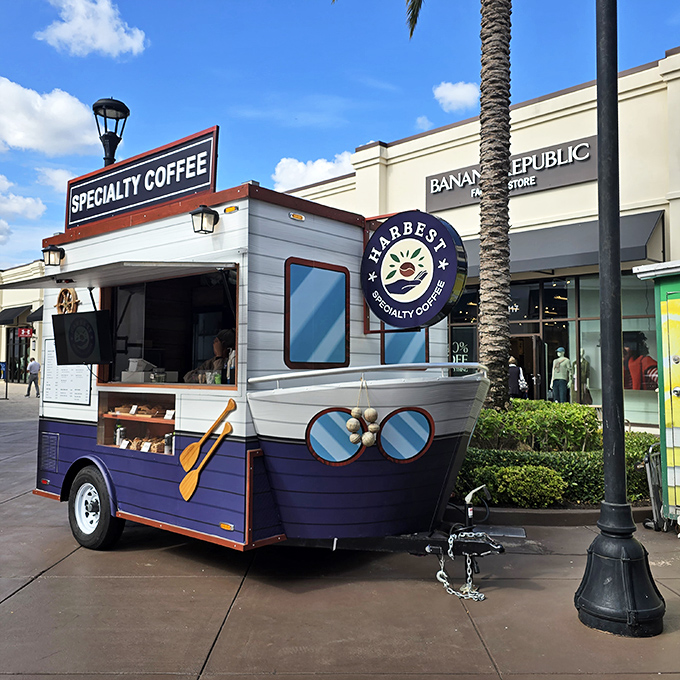 Harbor Specialty Coffee's whimsical boat-shaped kiosk offers liquid motivation for shoppers needing a caffeine boost between bargain hunts.