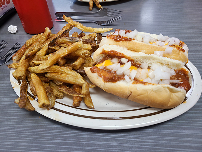 The classic combo that's launched a thousand food dreams: Coney dogs with hand-cut fries. Simple mathematics: dog + chili + fries = happiness.