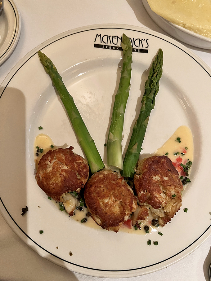 Crab cakes and asparagus spears—the ocean and garden in perfect harmony, like a delicious duet nobody asked for but everyone applauds.