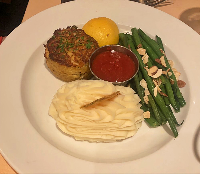 Maryland crabcake that's all crab and no filler, served with whipped potatoes and green beans&mdash;proof that sometimes the simplest presentations showcase the finest ingredients.