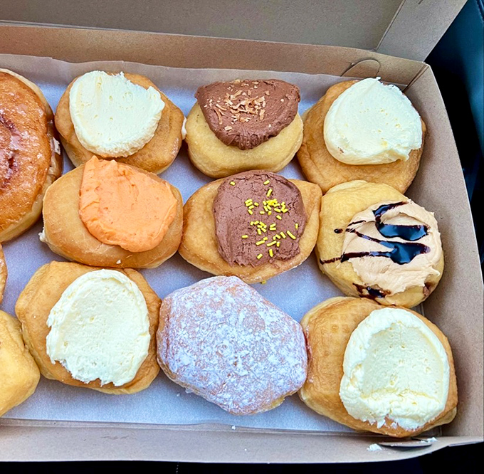 The cream-filled lineup showcases an array of frosting colors that would make Willy Wonka nod in professional approval.