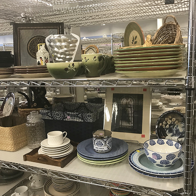 Mismatched dishware paradise where your eclectic tablescape dreams come true. That green leaf pattern? Someone's grandmother definitely approved.