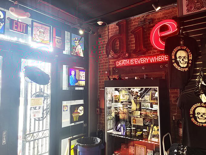 The gift shop's neon sign declares "Death is Everywhere," illuminating merchandise that walks the line between tasteful and tasteless.