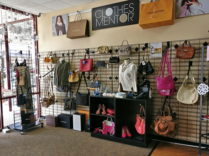 The designer section showcases luxury brands alongside shopping bags that hint at the store's upscale inventory—champagne labels on a beer budget.