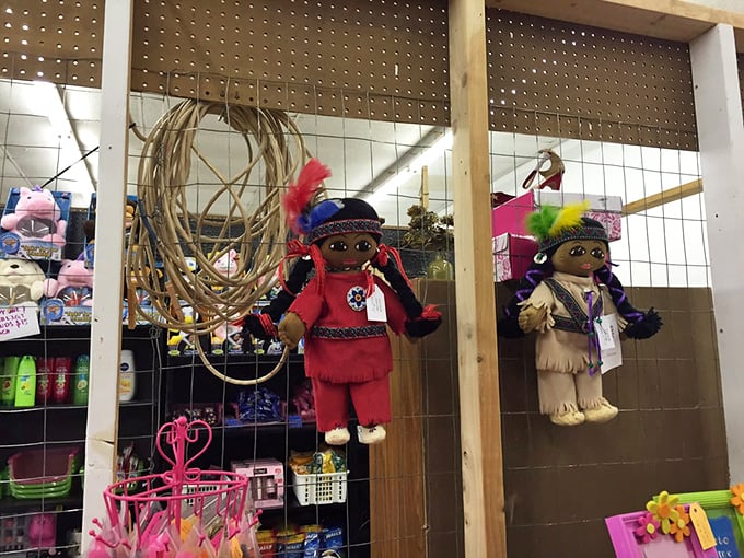 Native American-inspired dolls hang alongside handcrafted items—cultural artifacts that tell stories of Oklahoma's rich heritage through artisan craftsmanship.