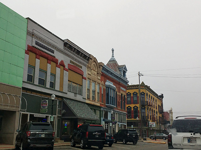 Colorful facades line downtown Huntington, each storefront a different personality in this small-town ensemble cast that outperforms any mall experience.