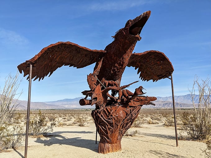 Soaring metal wings spread against the endless blue sky, this magnificent eagle sculpture captures the essence of wild freedom.