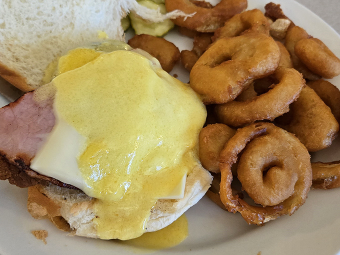 Eggs Benedict done right, with hollandaise that doesn't quit and sides that prove breakfast is truly the best meal.