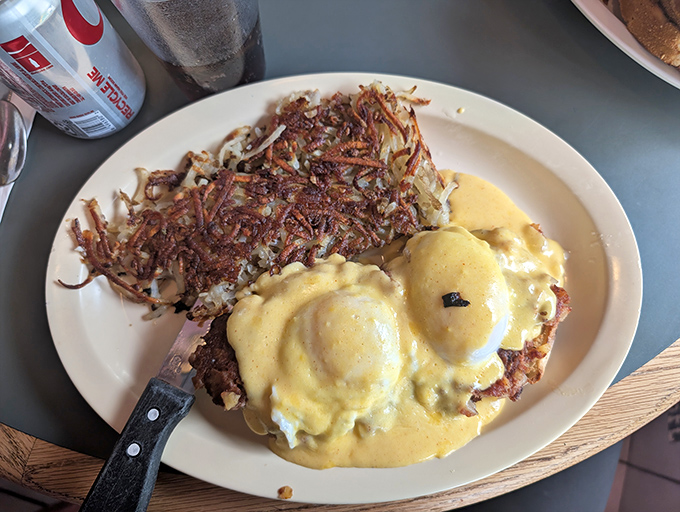 Hash browns with the ideal crisp-to-tender ratio paired with eggs benedict drowning happily in hollandaise. Breakfast architecture at its finest.