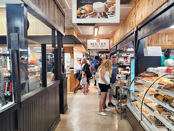 The Amish market's wood-paneled corridors beckon with the kind of authenticity that makes mall food courts weep.