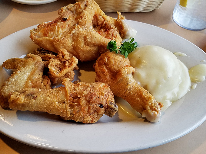 Fried chicken with a crust so perfectly golden and crisp, it makes you wonder if Colonel Sanders has been taking notes all these years.