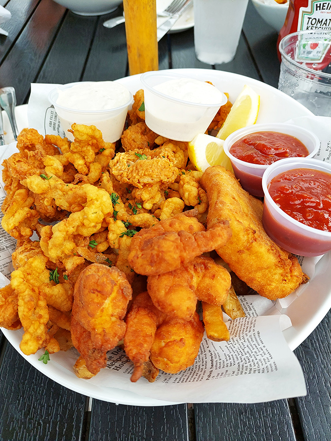 A seafood feast that would make Neptune himself jealous &ndash; golden-fried treasures from the deep, served with lemon wedges and dipping sauces.