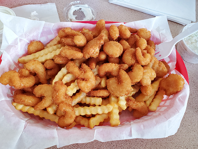 Golden-fried shrimp nestled among crinkle-cut fries&mdash;a match made in comfort food heaven. The kind of meal that makes you forget your diet resolutions.