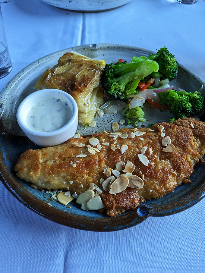 The star of the show: almond-crusted walleye that flakes at the mere suggestion of your fork. Minnesota's state fish has never looked so good in formal wear.