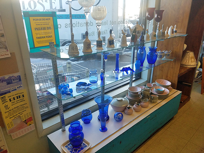 Cobalt blue treasures and delicate glassware line these shelves like an elegant garage sale curated by someone with impeccable taste. Vintage entertaining made affordable!