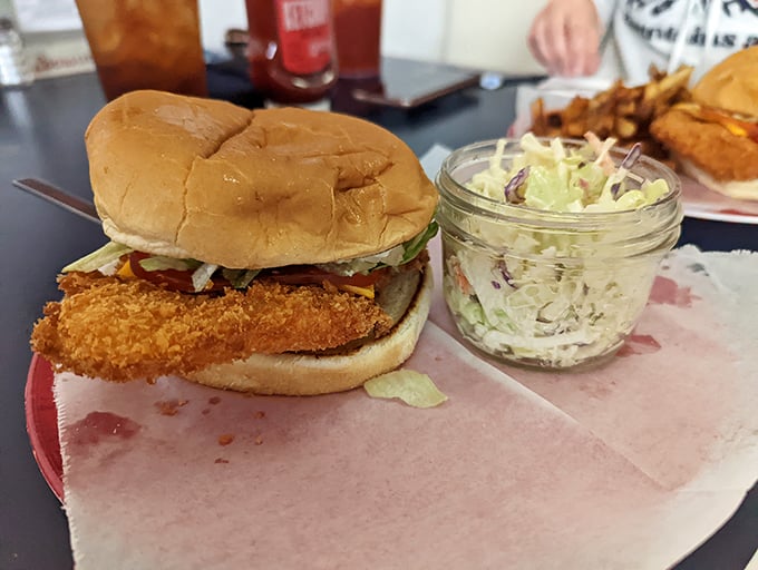 The halibut sandwich&mdash;where crispy meets fresh in a handheld celebration of Alaska's waters. That slaw adds the perfect crunch factor.