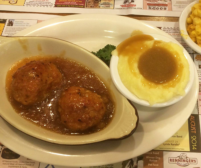 Ham balls swimming in glaze beside a crater of mashed potatoes&mdash;proof that Pennsylvania Dutch cuisine knows comfort food isn't just a meal, it's a warm hug on a plate.