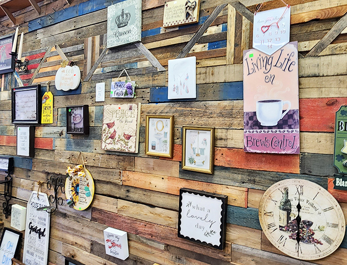 Inspirational signs and decorative pieces cover the reclaimed wood wall like a Pinterest board come to life, ready for new homes.