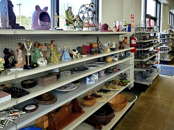 Porcelain figurines and wooden treasures create a museum of everyday art, each piece waiting for its perfect showcase spot.