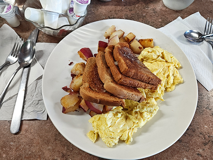 The breakfast trinity&mdash;golden eggs, perfectly browned toast, and home fries with that ideal crisp-tender balance&mdash;simple perfection that needs no Instagram filter.