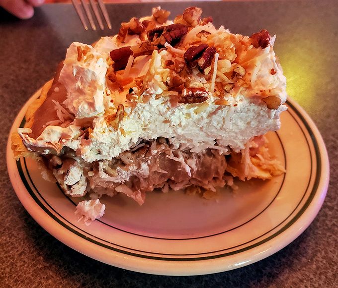 This isn't just pie&mdash;it's a towering monument to the art of dessert-making, where cream meets nuts in a relationship your taste buds will want to third-wheel. 