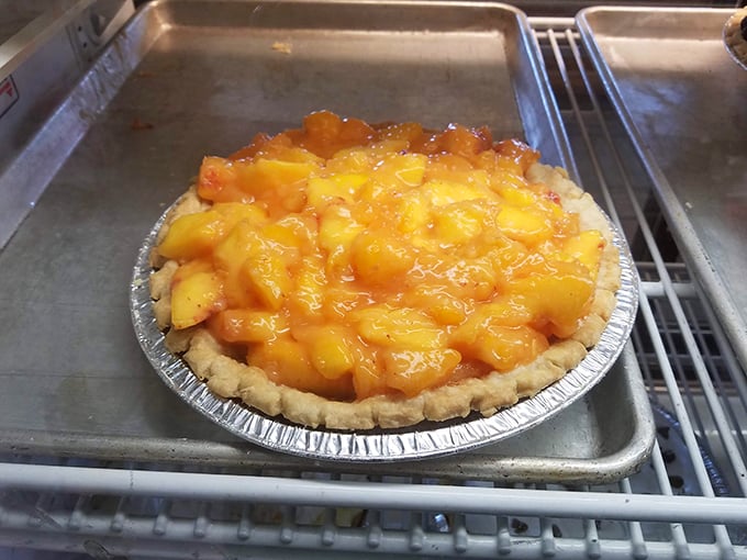 Peach pie that looks like sunshine captured in a crust. The only thing missing is a warning label: "May cause involuntary food moans."