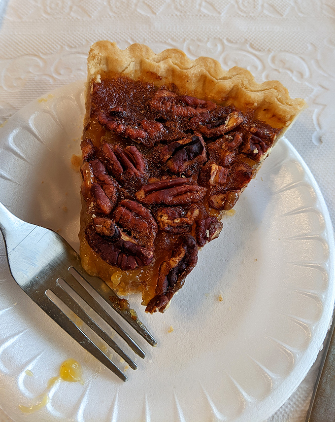 Pecan pie that would make a Southern grandmother nod in approval. Those perfectly arranged nuts are doing a synchronized swim in caramel glory.