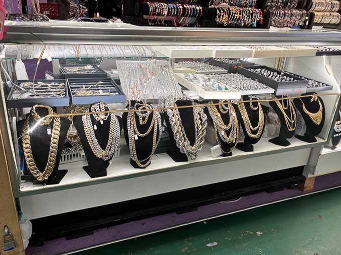 Gold chains gleaming under glass prove that looking like a million bucks doesn't require spending anywhere near it.