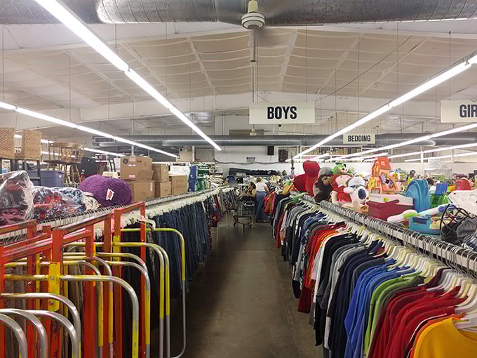 The children's section, organized with military precision. Those rainbow-colored clothing racks could outfit an entire elementary school with weekend wear.
