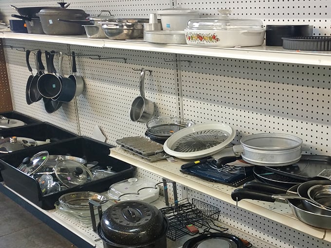 Pots, pans, and kitchen treasures hang like culinary constellations, each with stories of family recipes and dinner parties past.