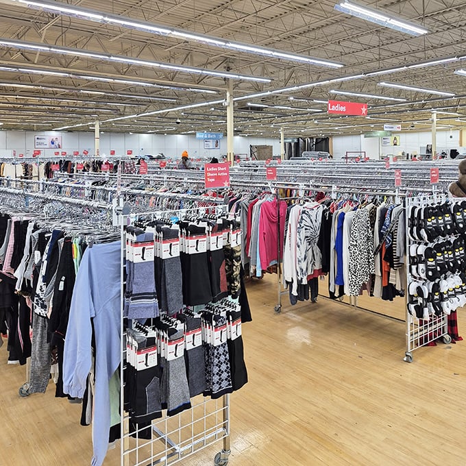Ladies' clothing arranged with department store precision but thrift store prices. That designer label hiding between polyester blouses? It's the thrifter's equivalent of striking oil.