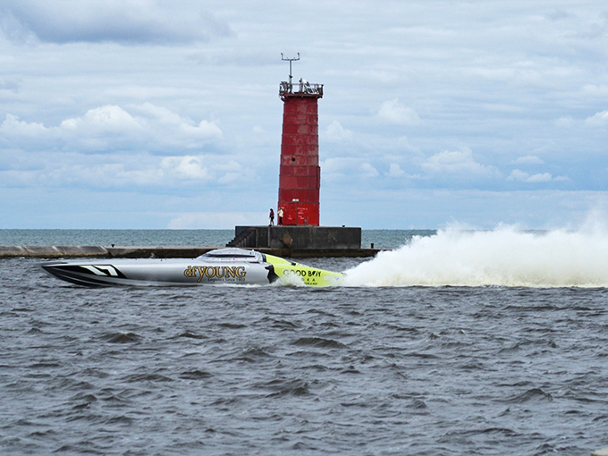 Speed meets serenity as a powerboat races past Sheboygan's iconic red lighthouse. Lake Michigan proving it can deliver adrenaline and picture-perfect moments simultaneously.