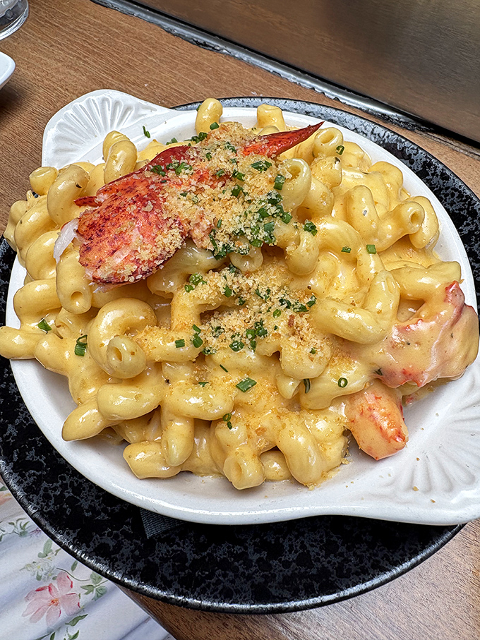 Lobster mac and cheese: where comfort food gets its passport stamped. Those chunks of pink perfection elevate this childhood favorite to sophisticated indulgence.
