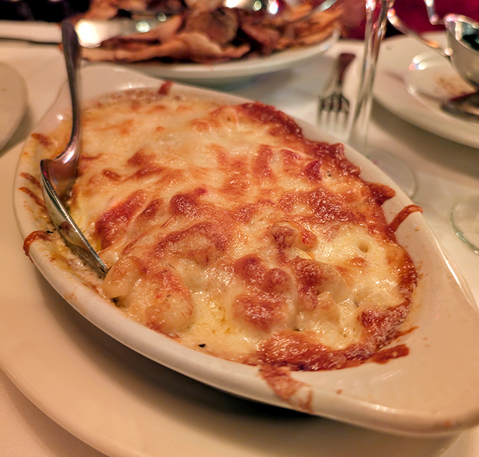 Mac and cheese that's had a glow-up. This bubbling cauldron of comfort food has graduated from kids' menu to sophisticated side with honors.