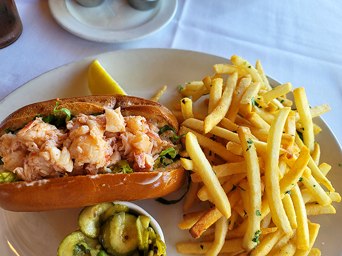 The lobster roll whispers sweet nothings to your taste buds, with chunks of meat so generous they're practically showing off.