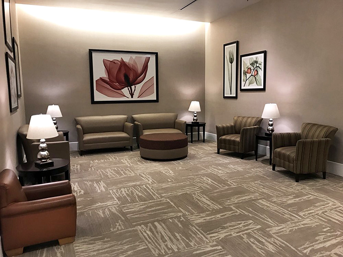This lounge area with its artwork and comfortable seating suggests someone understood that shopping partners need dignified waiting spaces.