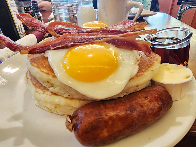 Pancake architecture at its finest. That sausage standing at attention seems to be saying, "You'll need me to balance all this maple-soaked goodness."