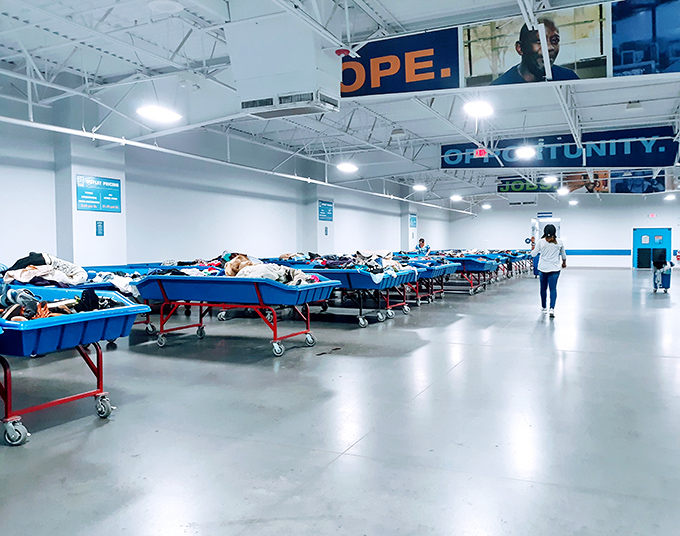 Behind the scenes, blue sorting bins overflow with donations waiting for their second act. One person's decluttering becomes another's discovery.