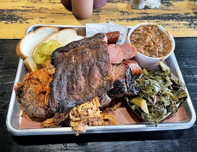 The carnivore's dream platter: where decisions are hard but regrets are impossible. Those collard greens aren't just a side&mdash;they're a revelation.