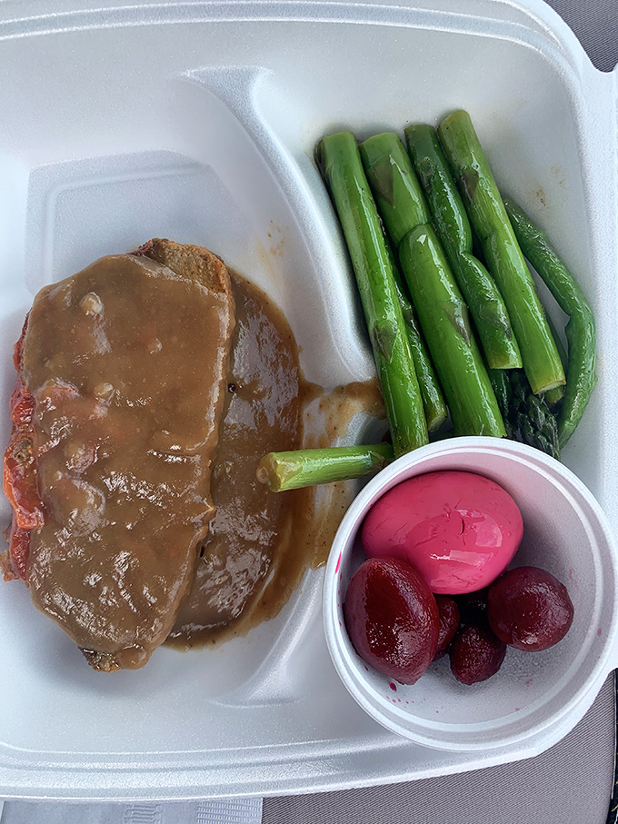 Meatloaf smothered in gravy alongside asparagus and pickled beets&mdash;the holy trinity of Pennsylvania Dutch comfort on a takeout tray.