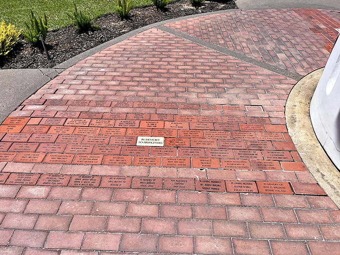 Memorial bricks create a pathway of remembrance, each one telling a story of courage and dedication.