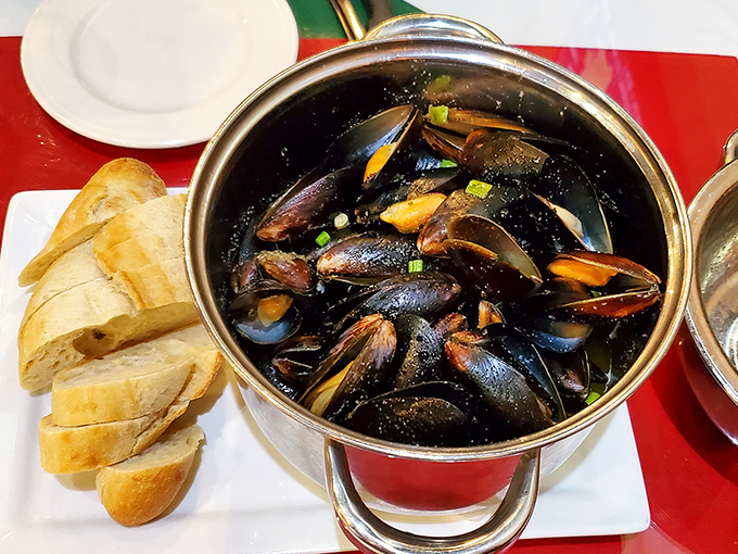 Steamed mussels in their gleaming pot with crusty bread alongside&mdash;a simple pleasure that transcends geography and speaks the universal language of delicious.